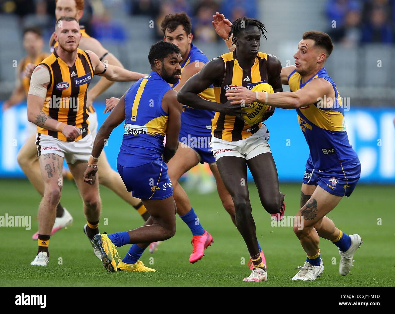 Changkuoth Jiath of the Hawks holds of Nic Reid of the Eagles during ...