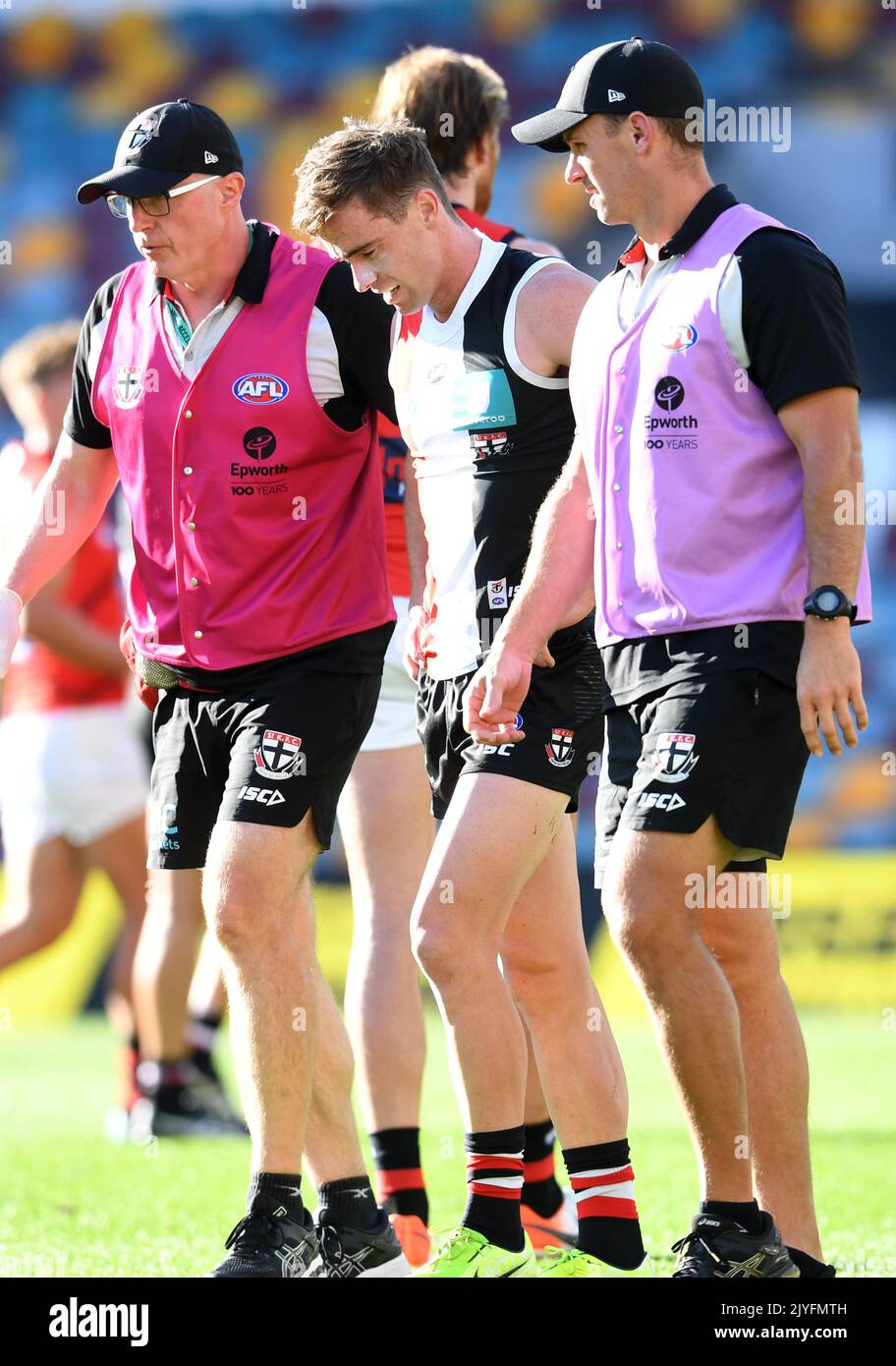 Ben Paton of the Saints is taken off the field injured during the Round ...