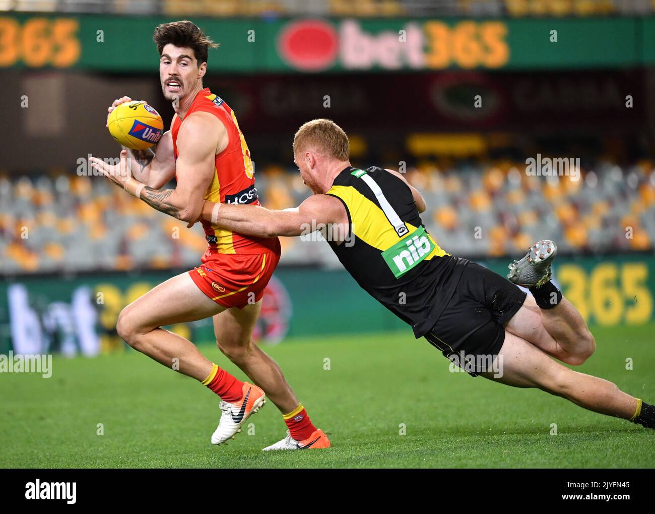 Alex Sexton (left) of the Suns gets past Nick Vlastuin (right) of the ...