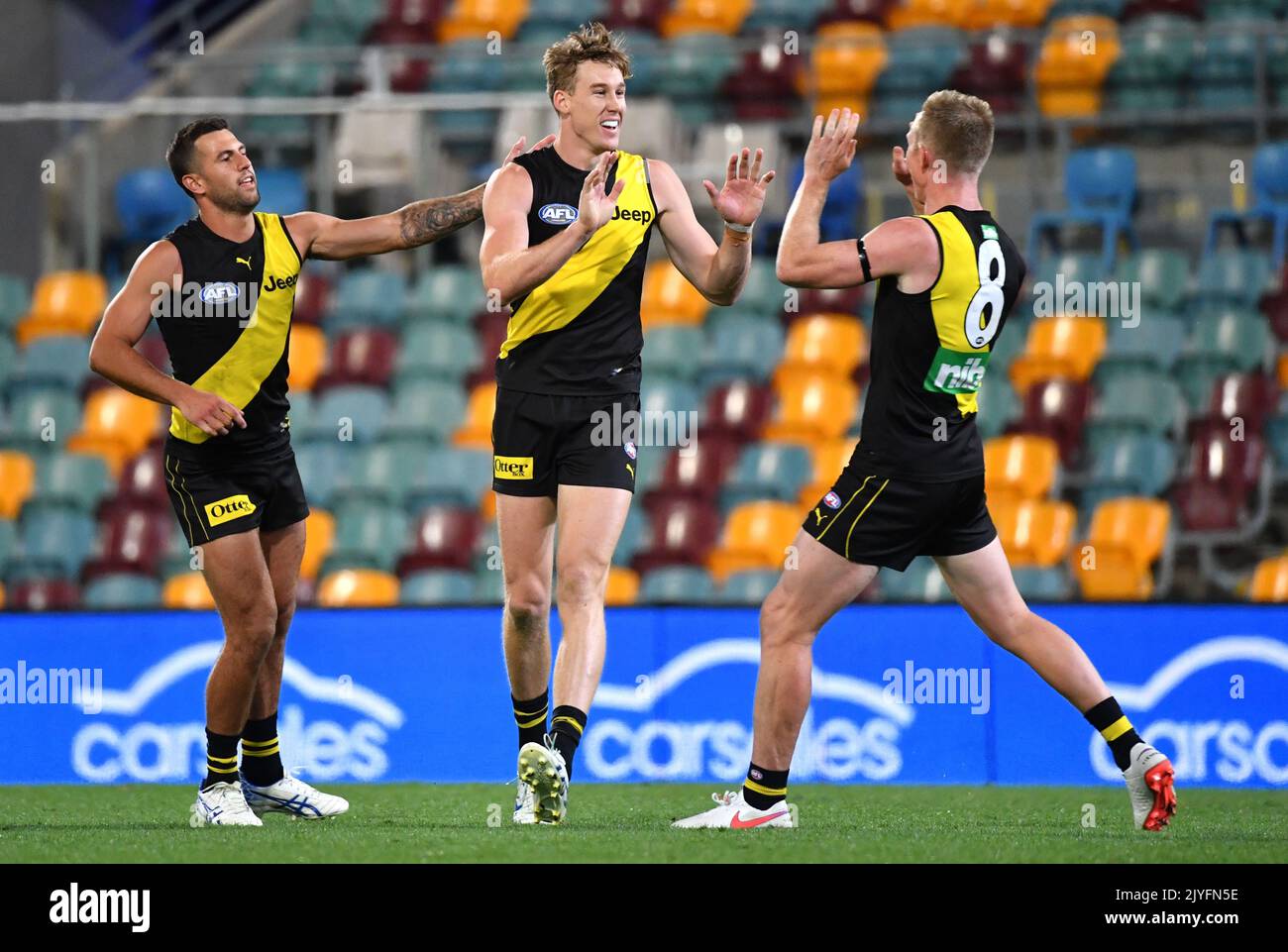 Tom Lynch (centre) of the Tigers celebrates kicking a goal with Jack ...