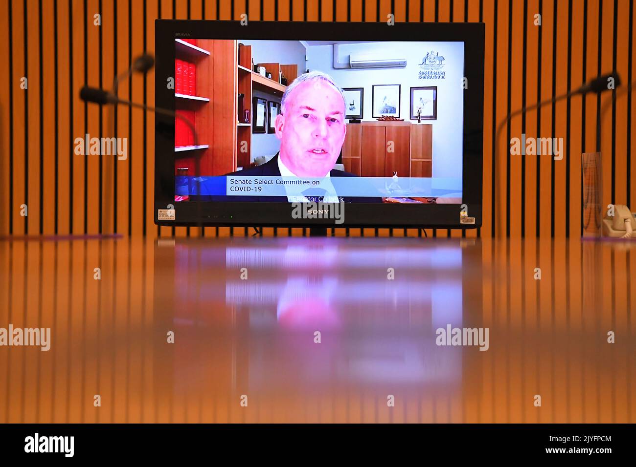 Minister for Aged Care Richard Colbeck appears via video link at the ...