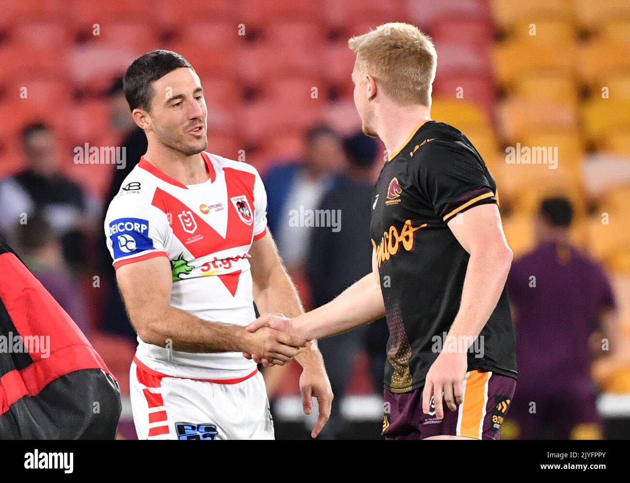 Ben Hunt (left) of the Dragons and Tom Dearden (right) of the Broncos ...