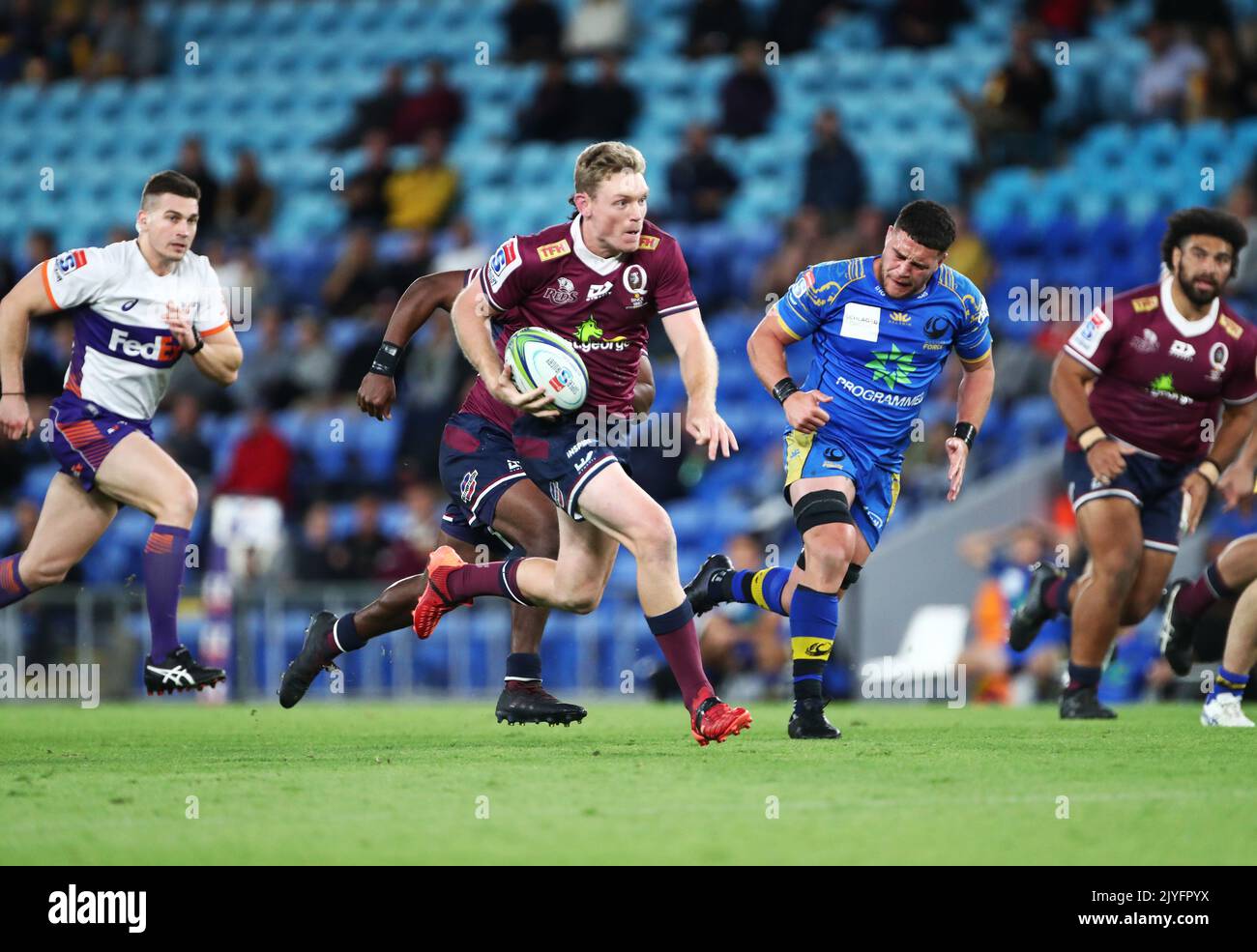 Bryce Hegarty of The Reds breaks through to score a try during the ...
