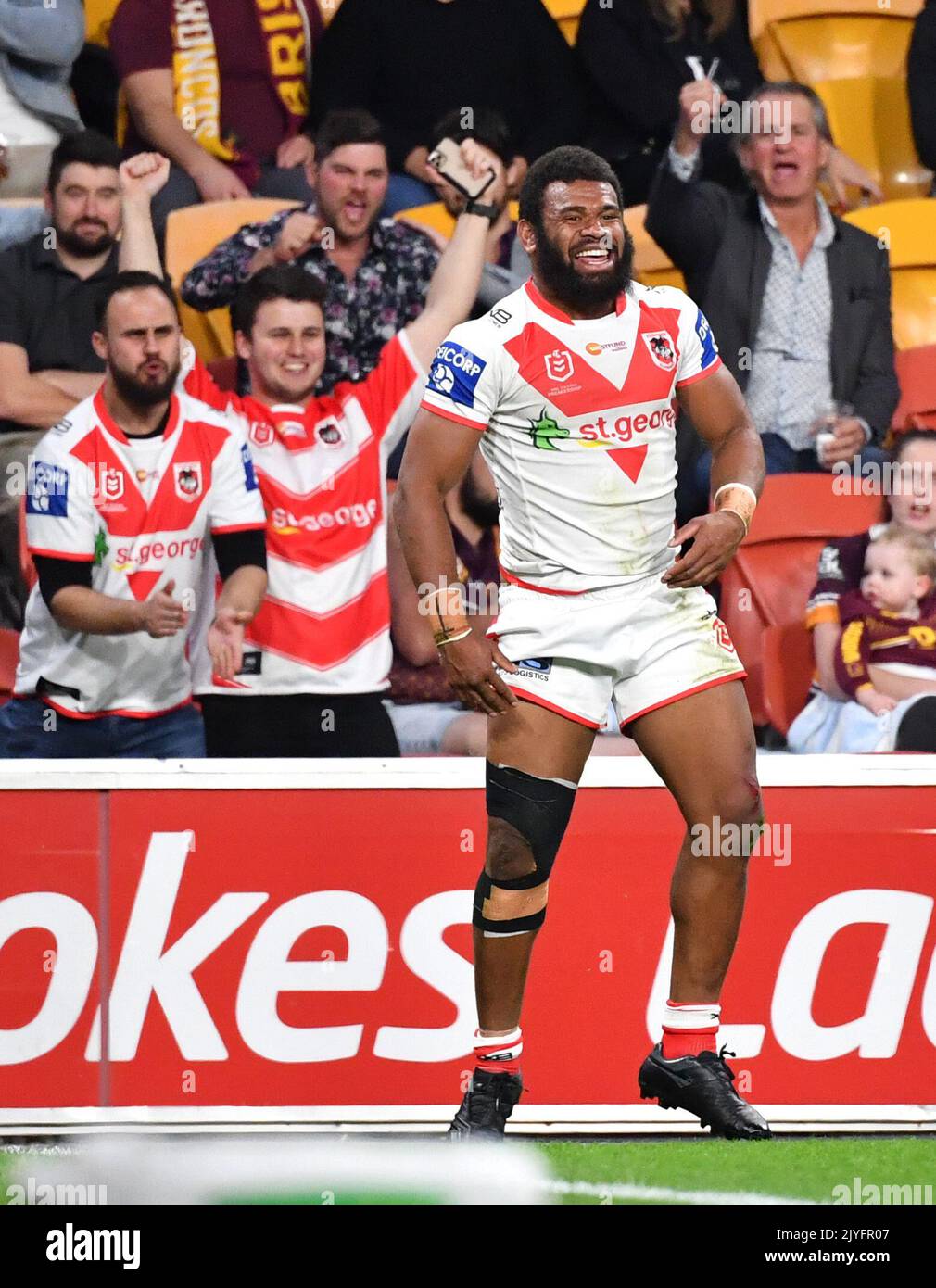 Mikaele Ravalawa of the Dragons celebrates scoring a try during the ...