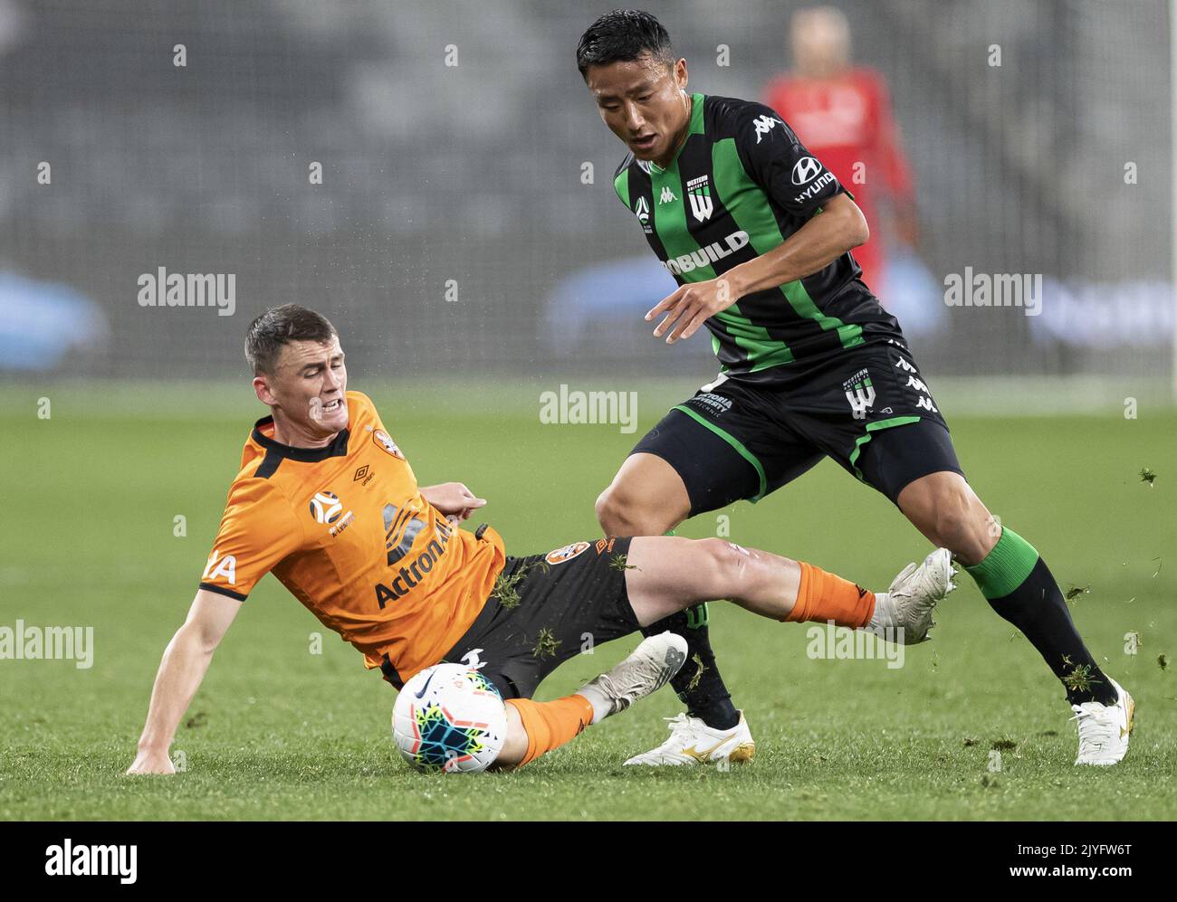 Dylan Wenzel-Halls of Brisbane is tackled by Tomoki Imai of Western ...