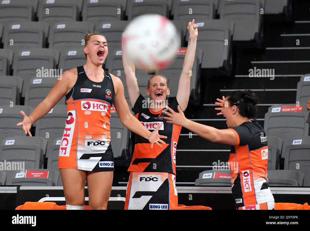 Matilda McDonell (left) and April Brandley (centre) of the Giants ...