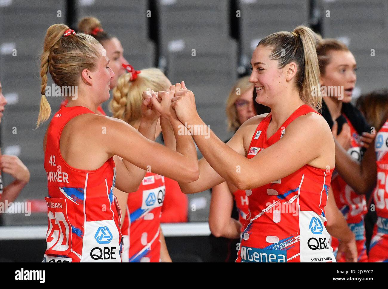 Maddy Turner (left) and Sophie Garbin (right) of the Swifts celebrate ...