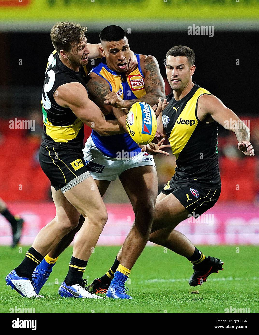 Kane Lambert of the Tigers (left) competes with Tim Kelly of the Eagles ...