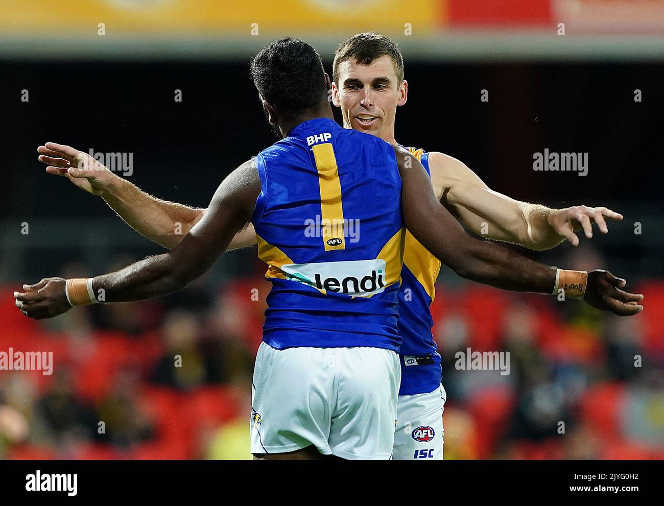 Jamie Cripps of the Eagles (right) reacts with Liam Ryan after Ryan ...