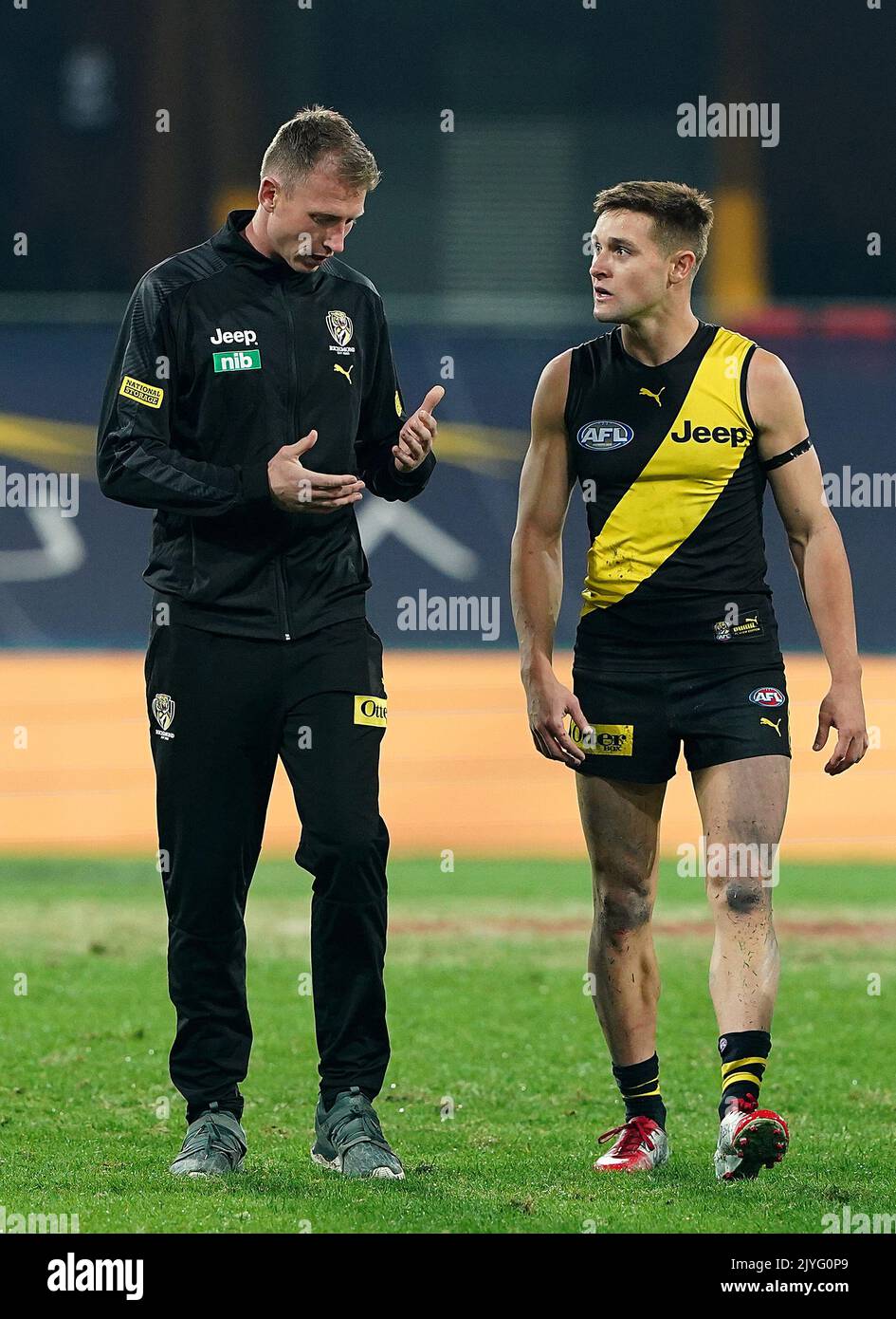 Dylan Grimes of the Tigers (left) is seen following the Round 14 AFL ...