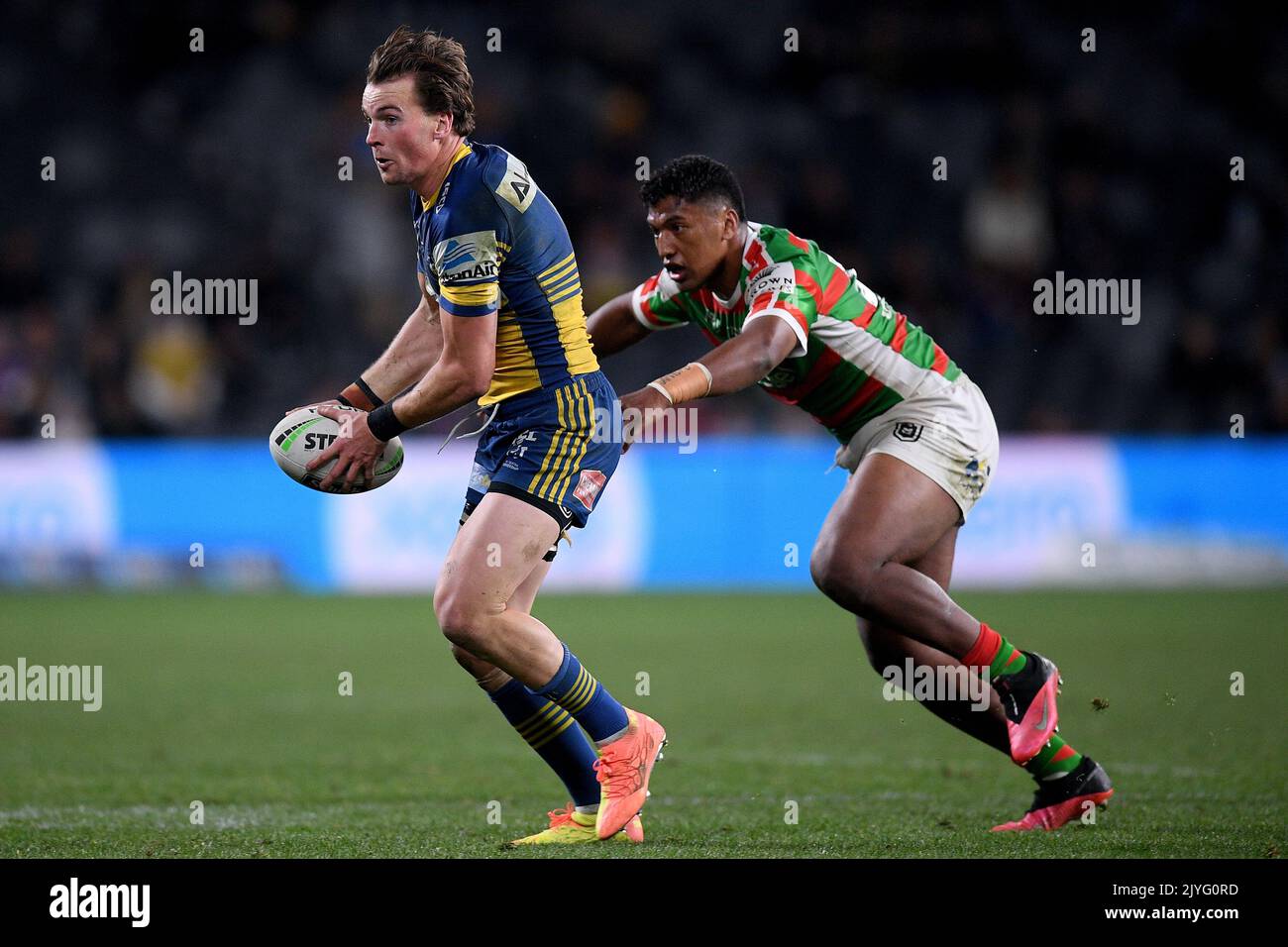 Clint Gutherson of the Eels is tackled by Steven Marsters of the ...