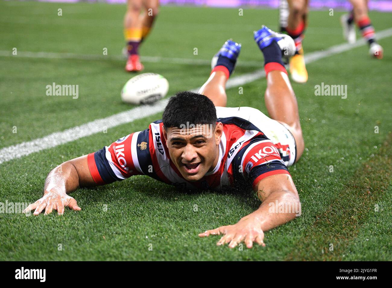 Daniel Tupou of the Roosters scores a try during the round 16 NRL match ...