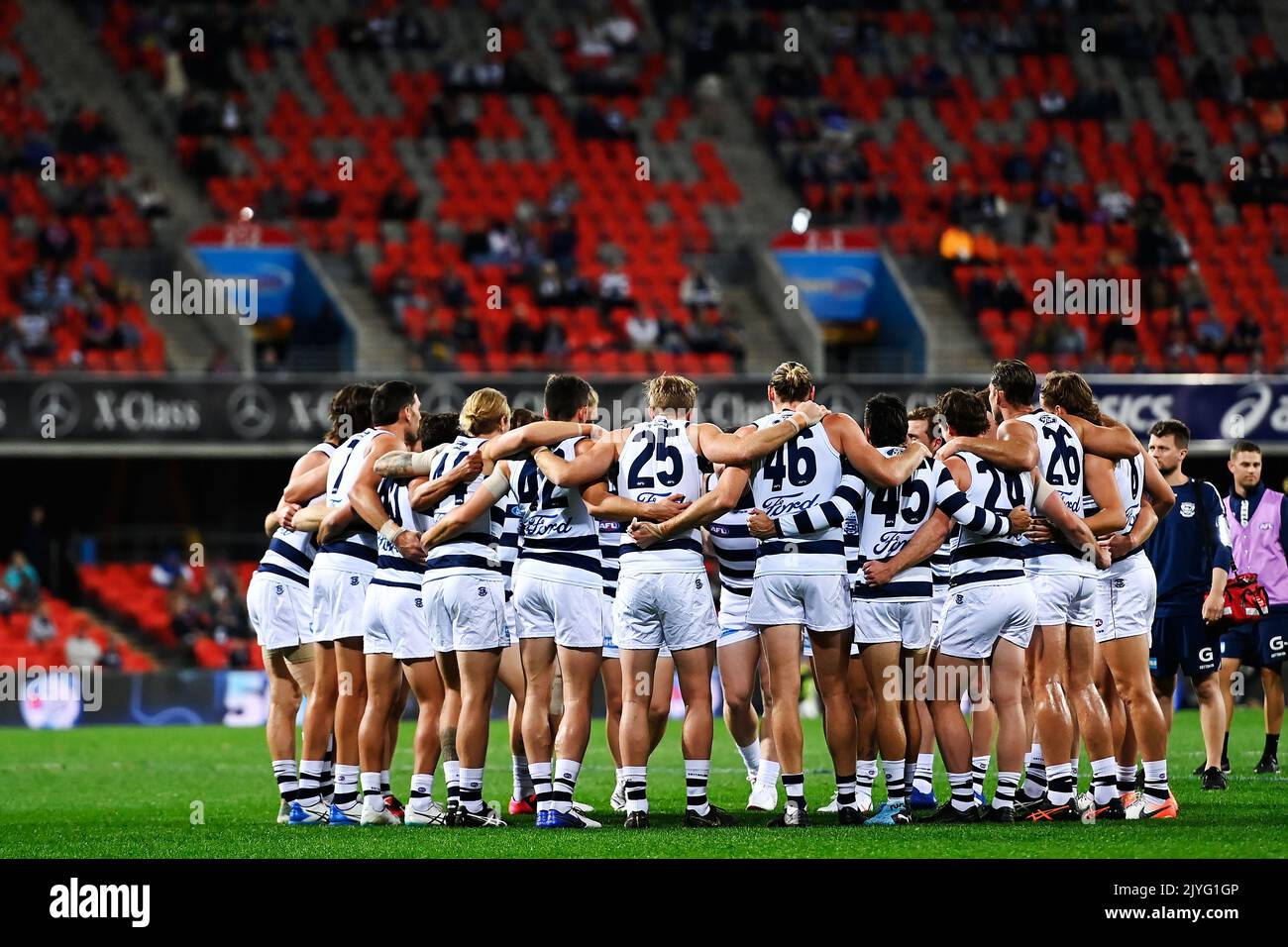 The Geelong Cats huddle during the round 14 AFL match between the ...