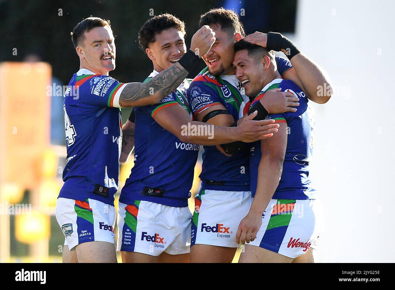 Roger Tuivasa-Sheck of the Warriors (right) celebrates with teammates ...