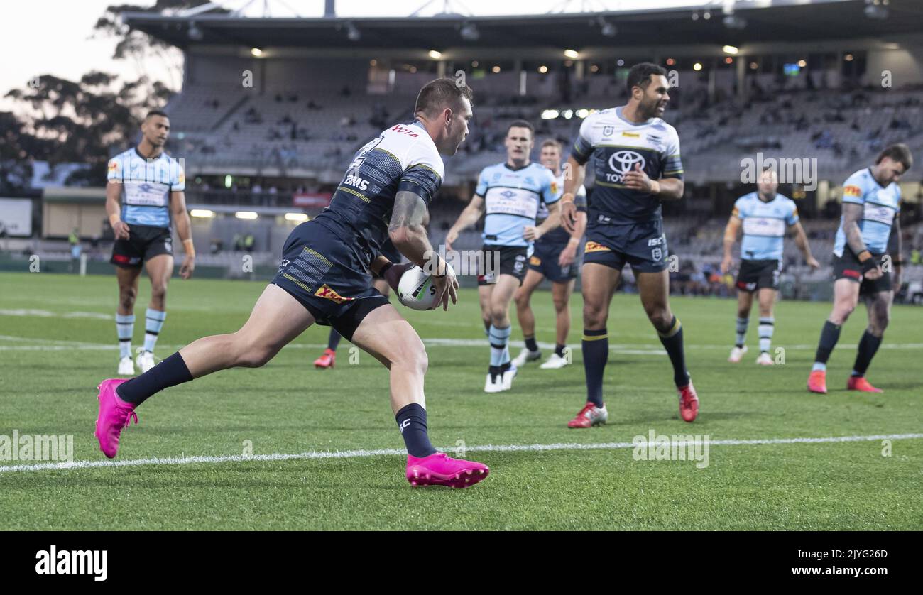Kyle Feldt of the Cowboys scores during the Round 16 NRL match between ...