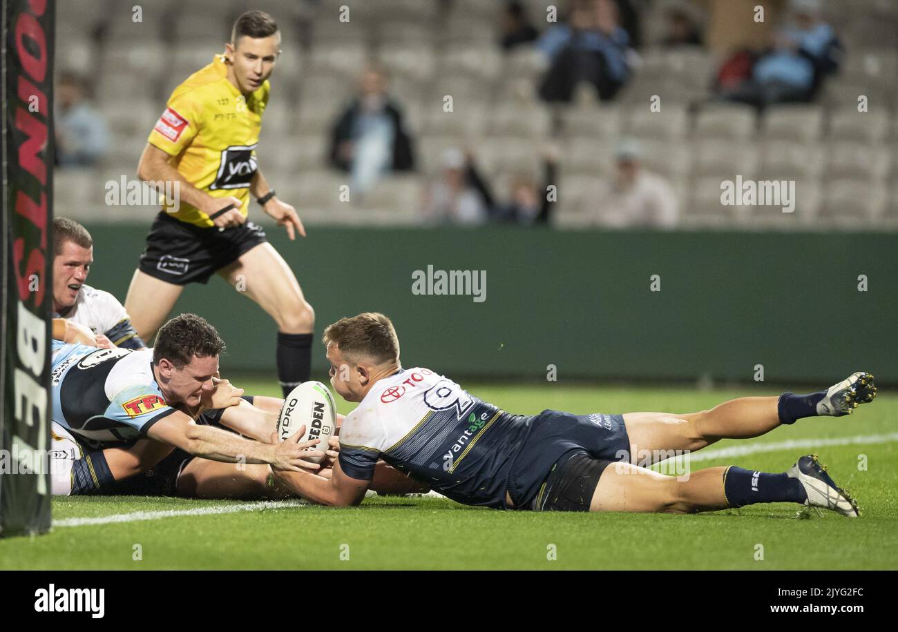 Connor Tracey of the Sharks scores during the Round 16 NRL match ...