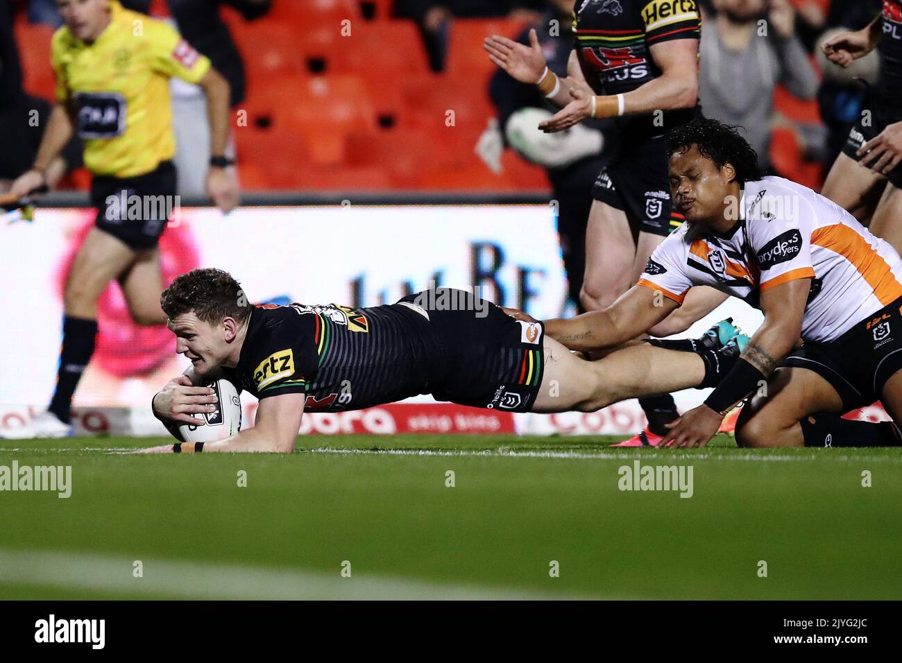 Liam Martin of the Panthers scores a try during the Round 16 NRL match ...