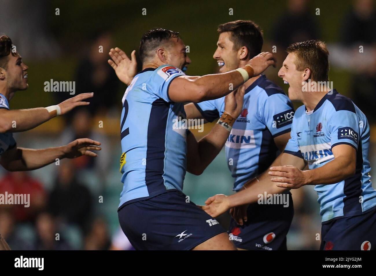 Joey Walton of the Waratahs celebrates his try with his team mates ...