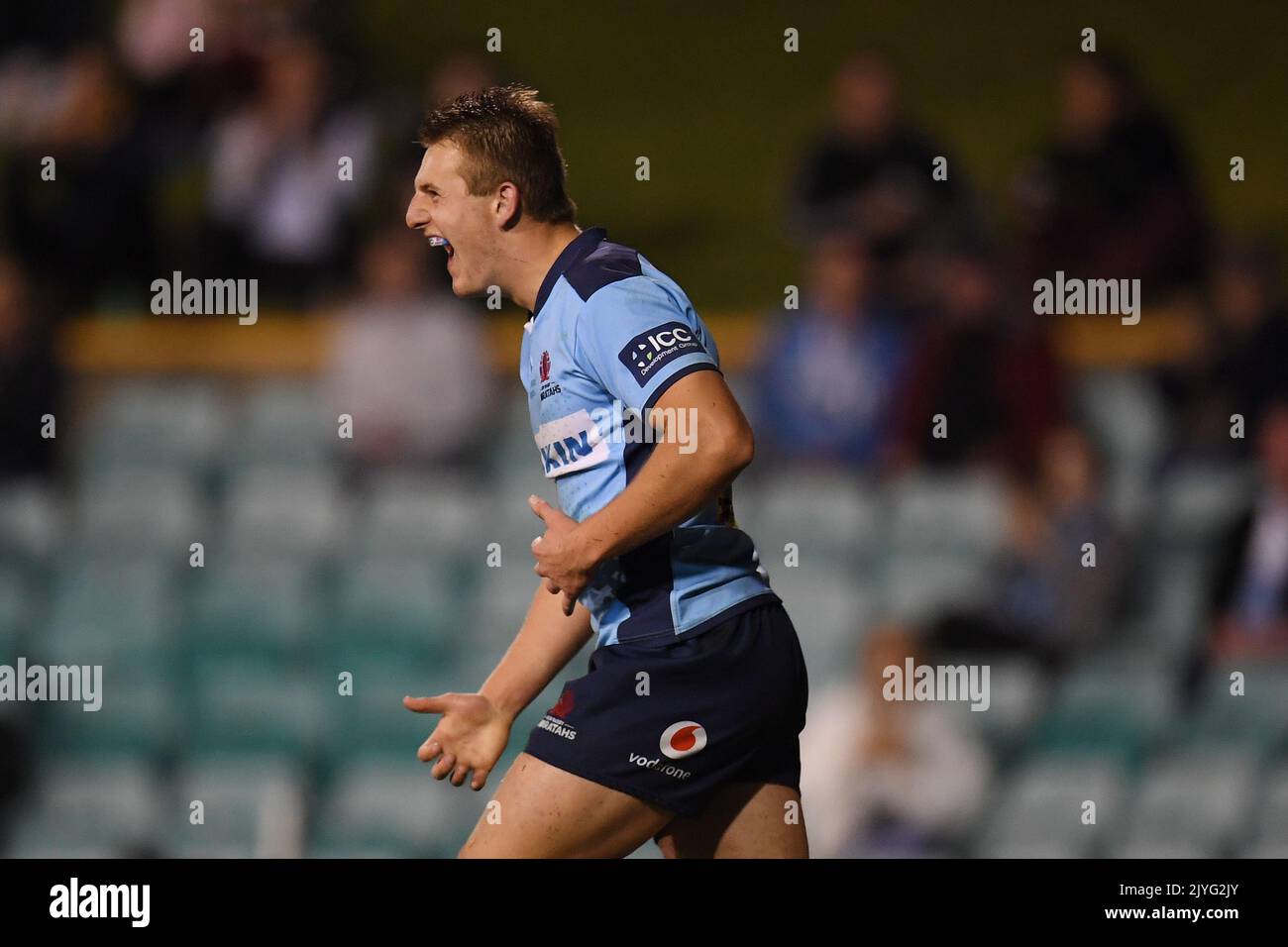 Joey Walton of the Waratahs celebrates his try with his team mates ...