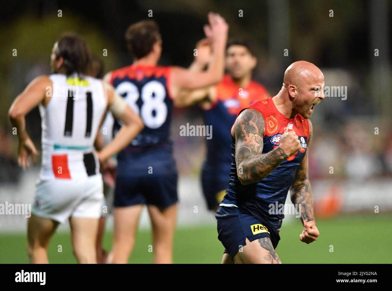 Nathan Jones (right) of the Demons celebrates during the Round 14 AFL ...