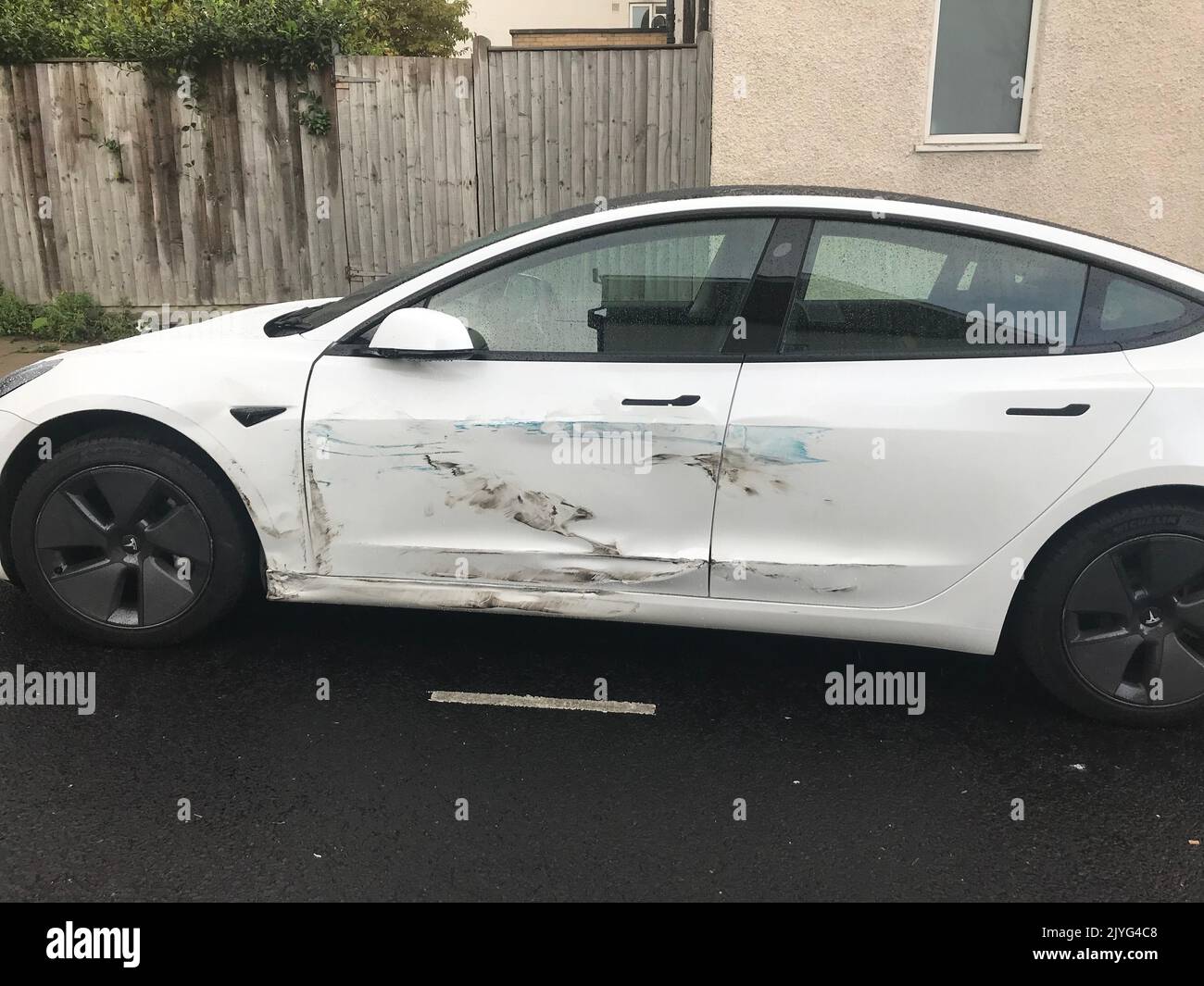 A damaged white Tesla at the scene in Kirkstall Gardens, Streatham Hill ...