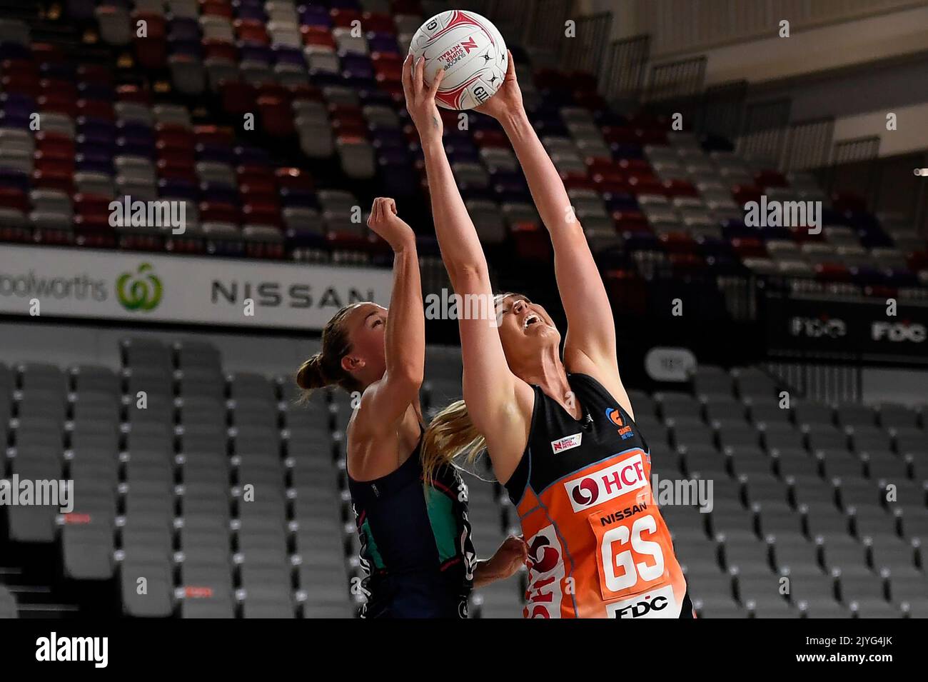 Emily Mannix of the Vixens and Caitlin Bassett of the Giants compete ...