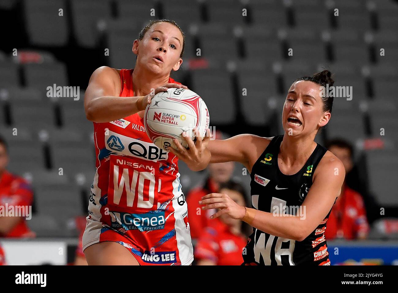 Sophie Craig of the Swifts and Kelly Altmann of the Magpies compete for ...