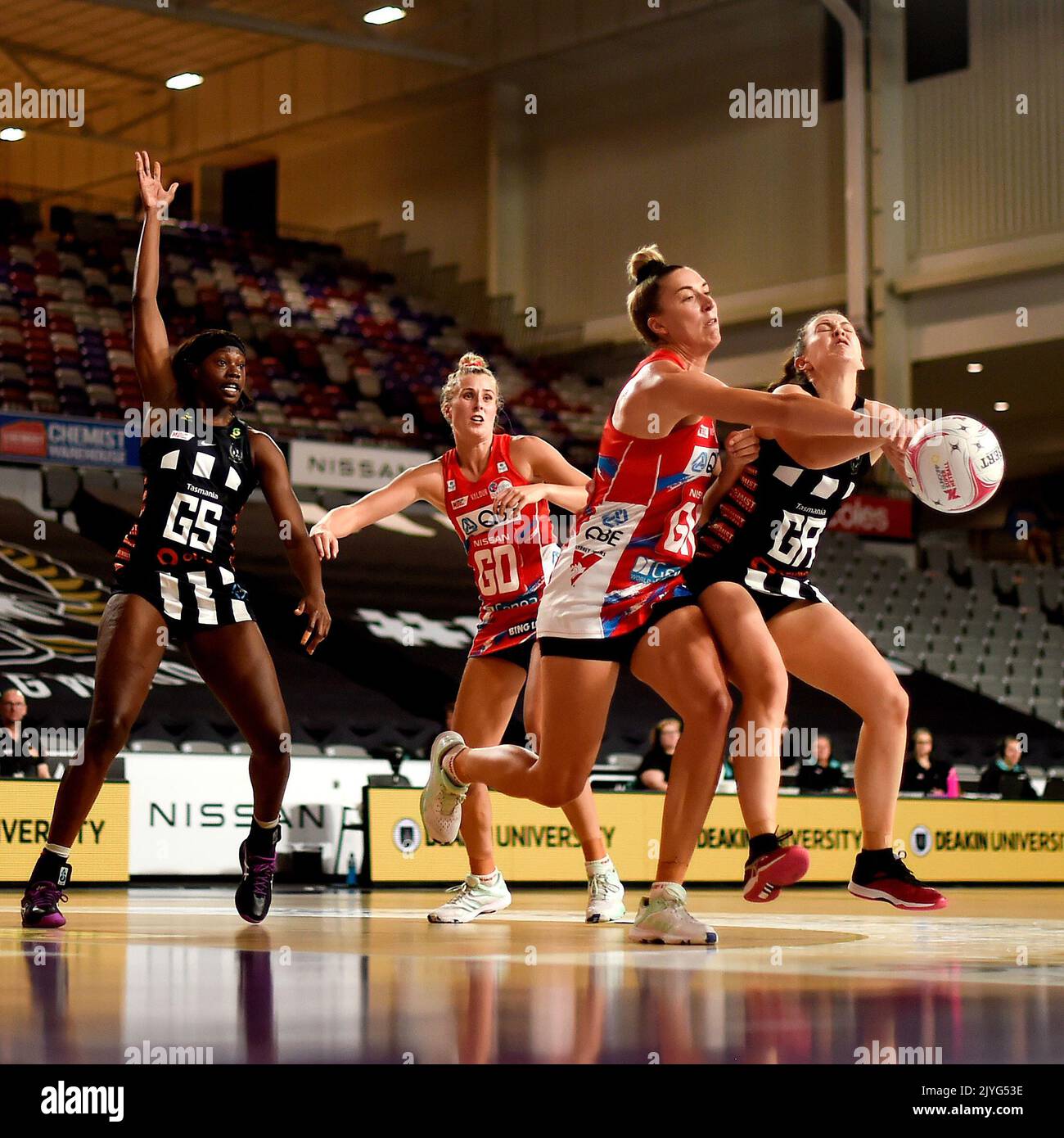 Sarah Klau of the Swifts and Gabrielle Sinclair of the Magpies compete ...