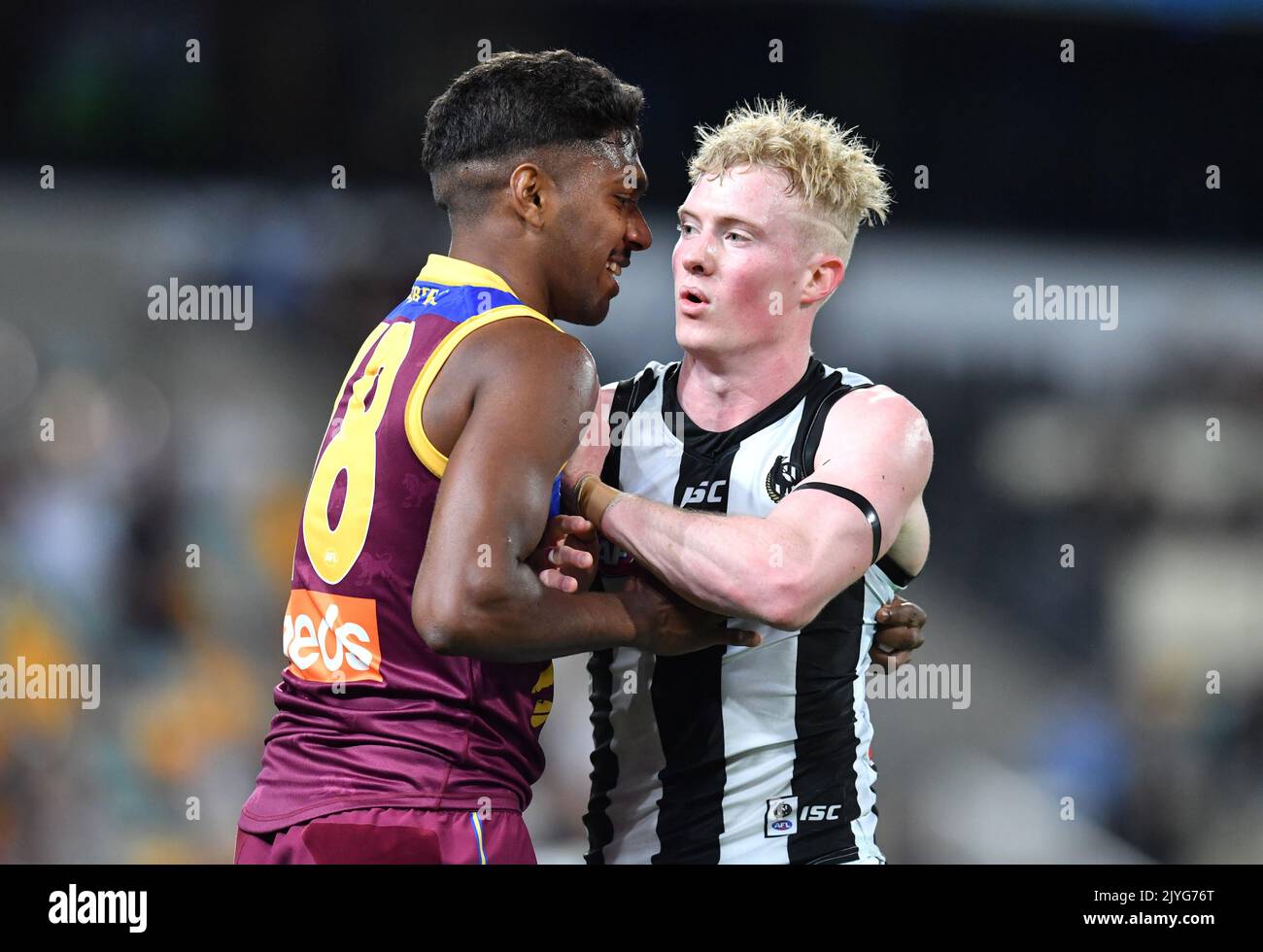 Keidean Coleman (left) of the Lions grapples with John Noble (right) of ...