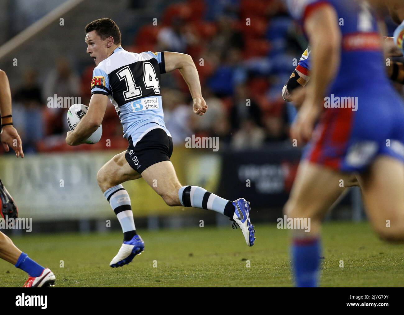 Connor Tracey of the Sharks makes a break during the Round 17 NRL match ...