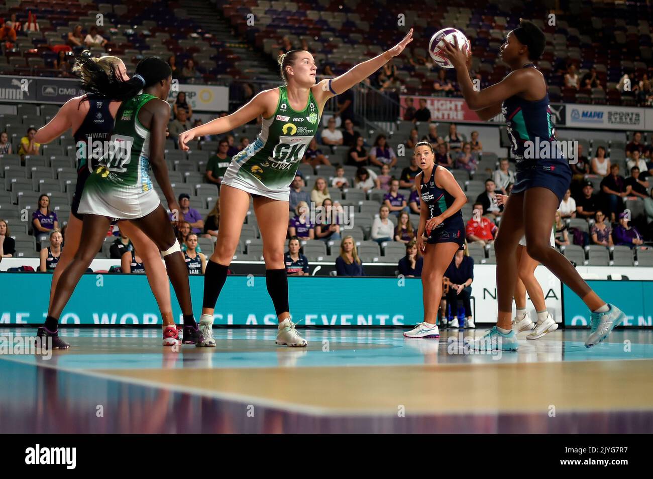 Courtney Bruce of the Fever defends against Mwai Kumwenda of the Vixens ...