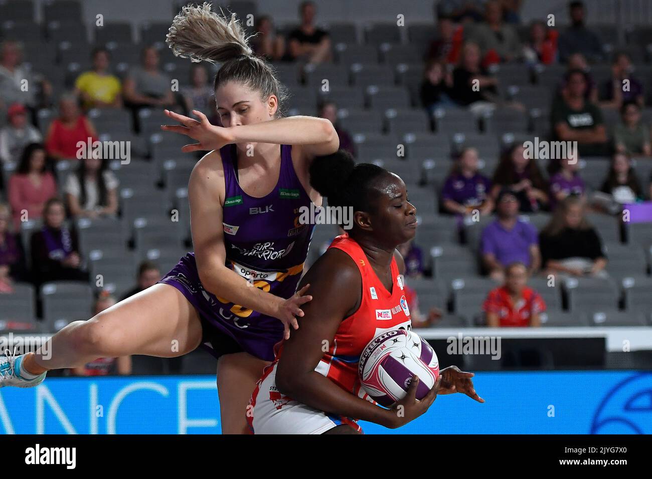 Kim Jenner of the Firebirds and Sam Wallace of the Swifts compete for ...