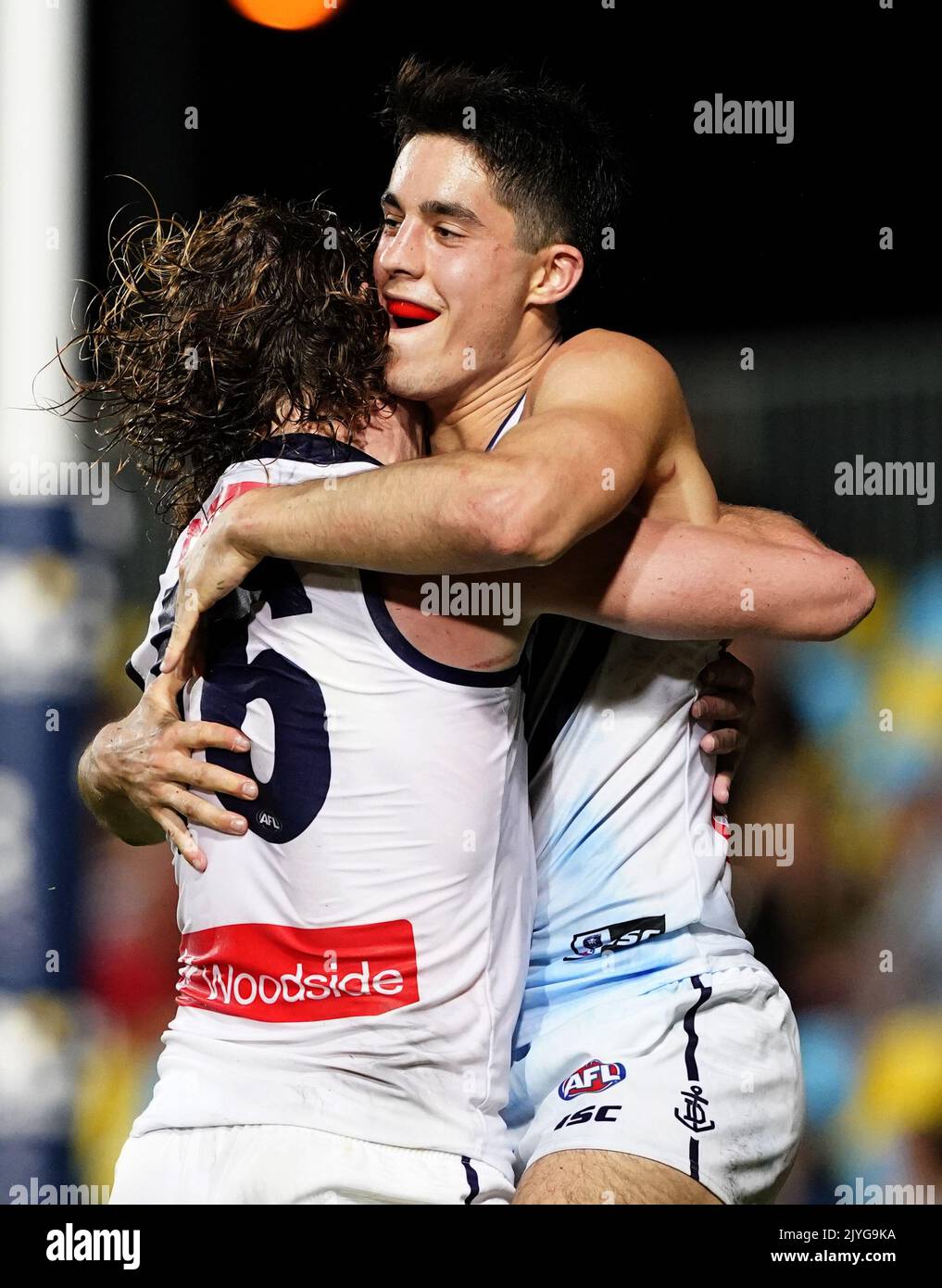 Adam Cerra of the Dockers (left) reacts with David Mundy after kicking ...