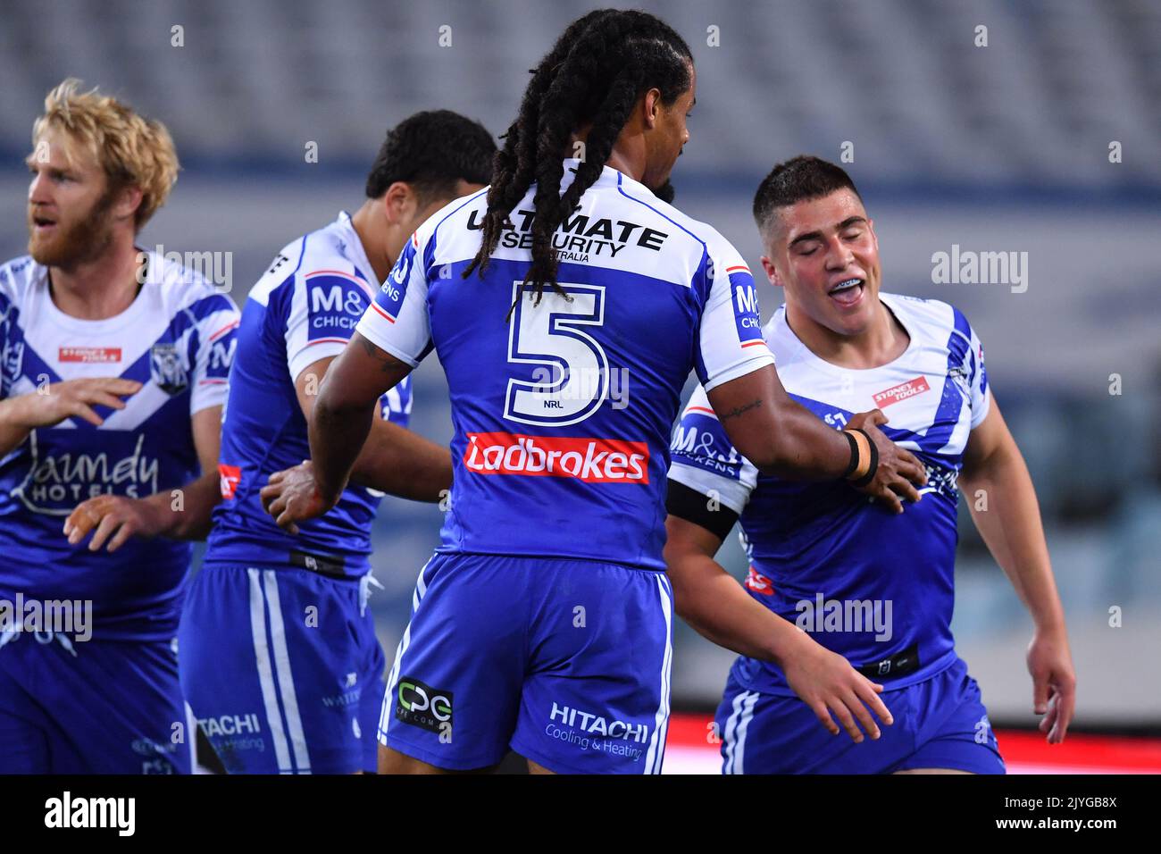 Matt Doorey of the Bulldogs celebrates his try with Jayden Okunbor ...