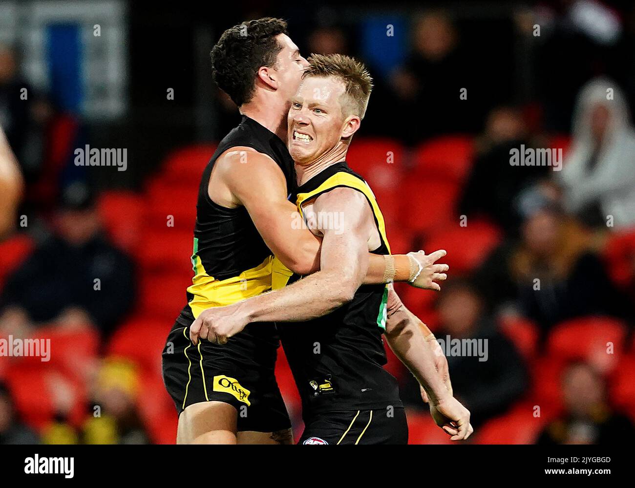 Jack Riewoldt of the Tigers (right) reacts after kicking a goal during ...