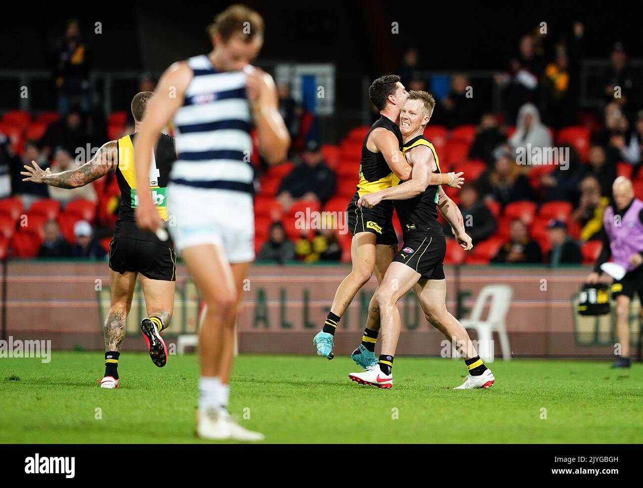 Jack Riewoldt of the Tigers (right) reacts after kicking a goal during ...