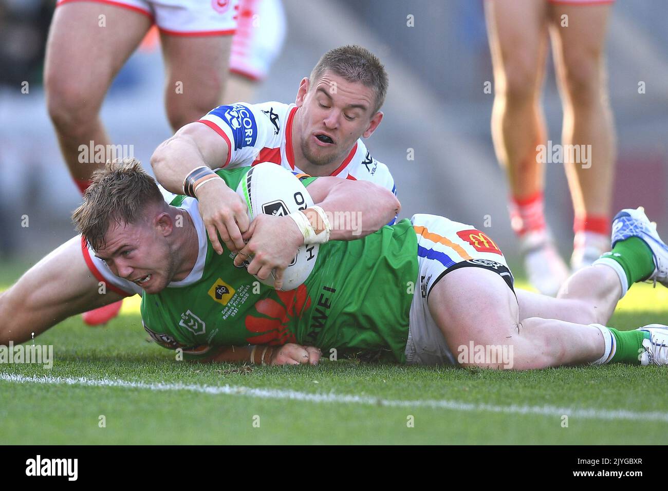 Hudson Young of the Raiders is tackled by Matt Duffy of the Dragons ...