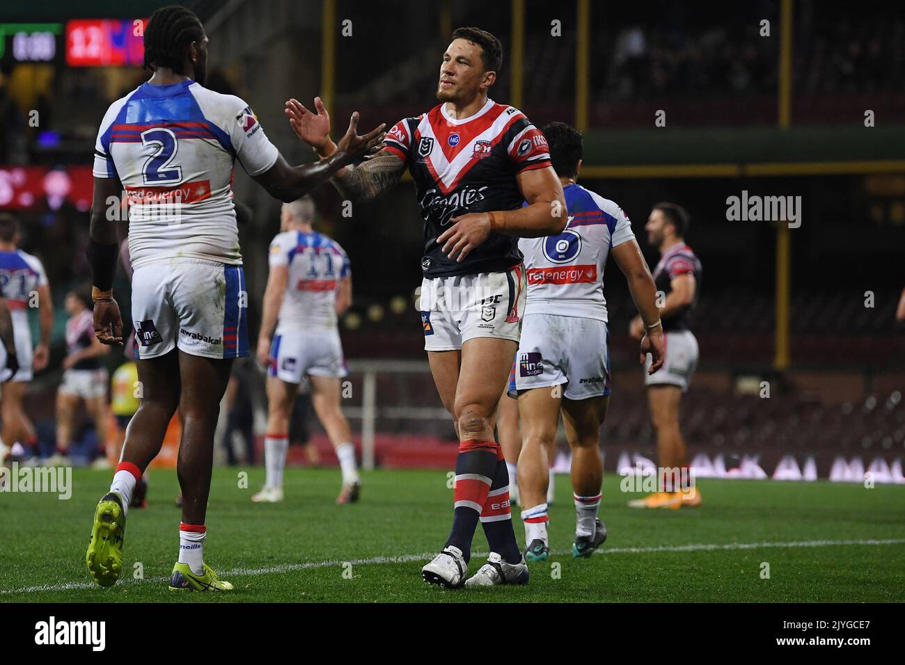 Sonny Bill Williams of the Roosters and Edrick Lee of the Knights ...