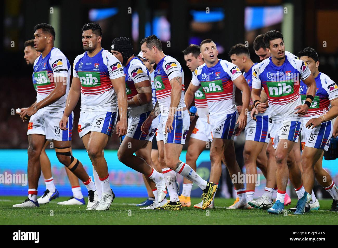 A dejected Knights during the Round 18 NRL match between the Sydney ...