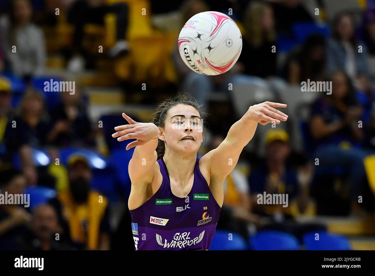 Macy Gardner of the Firebirds passes the ball during the Round 12 Super ...
