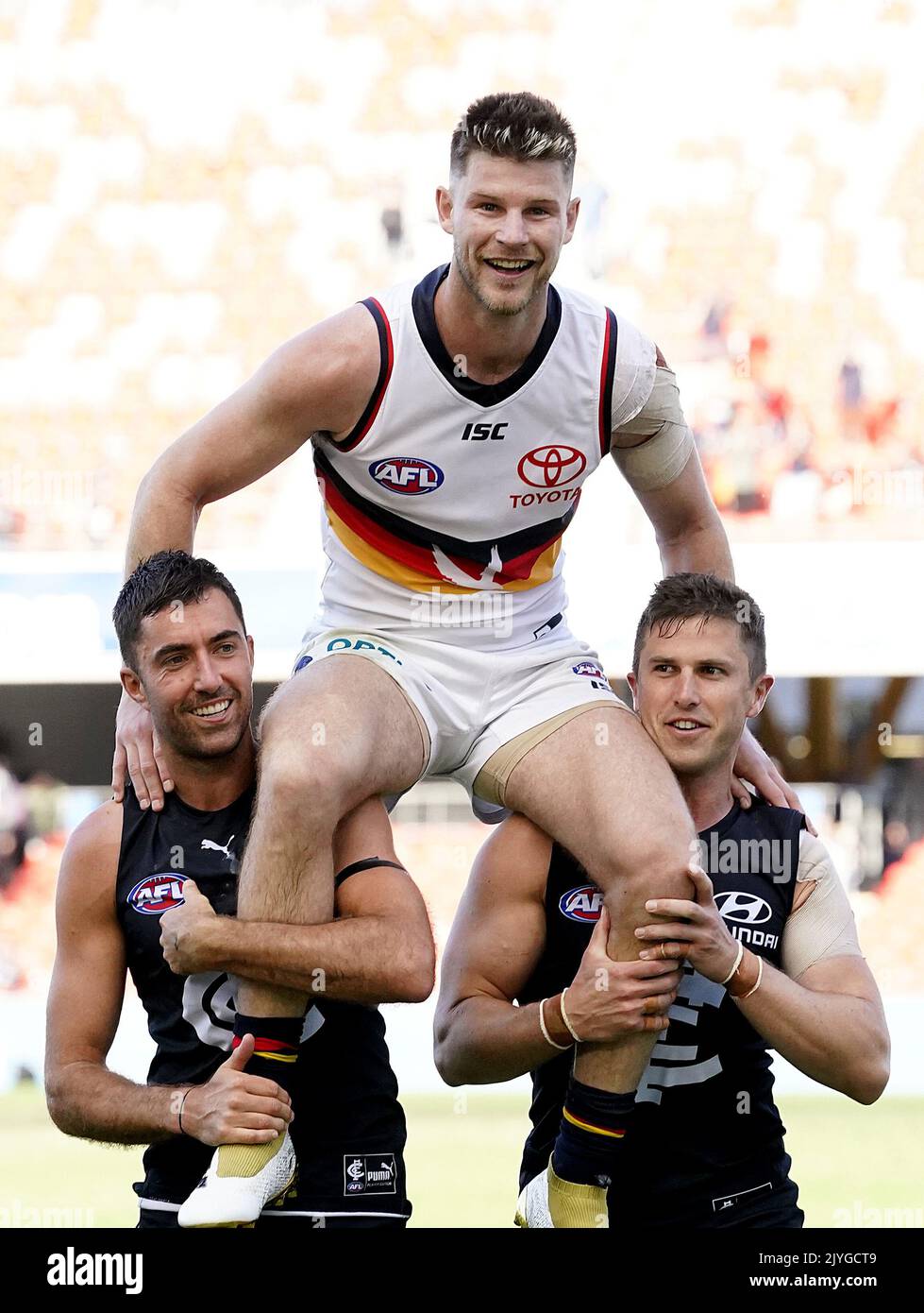 A retiring Bryce Gibbs of the Crows is chaired from the field following ...