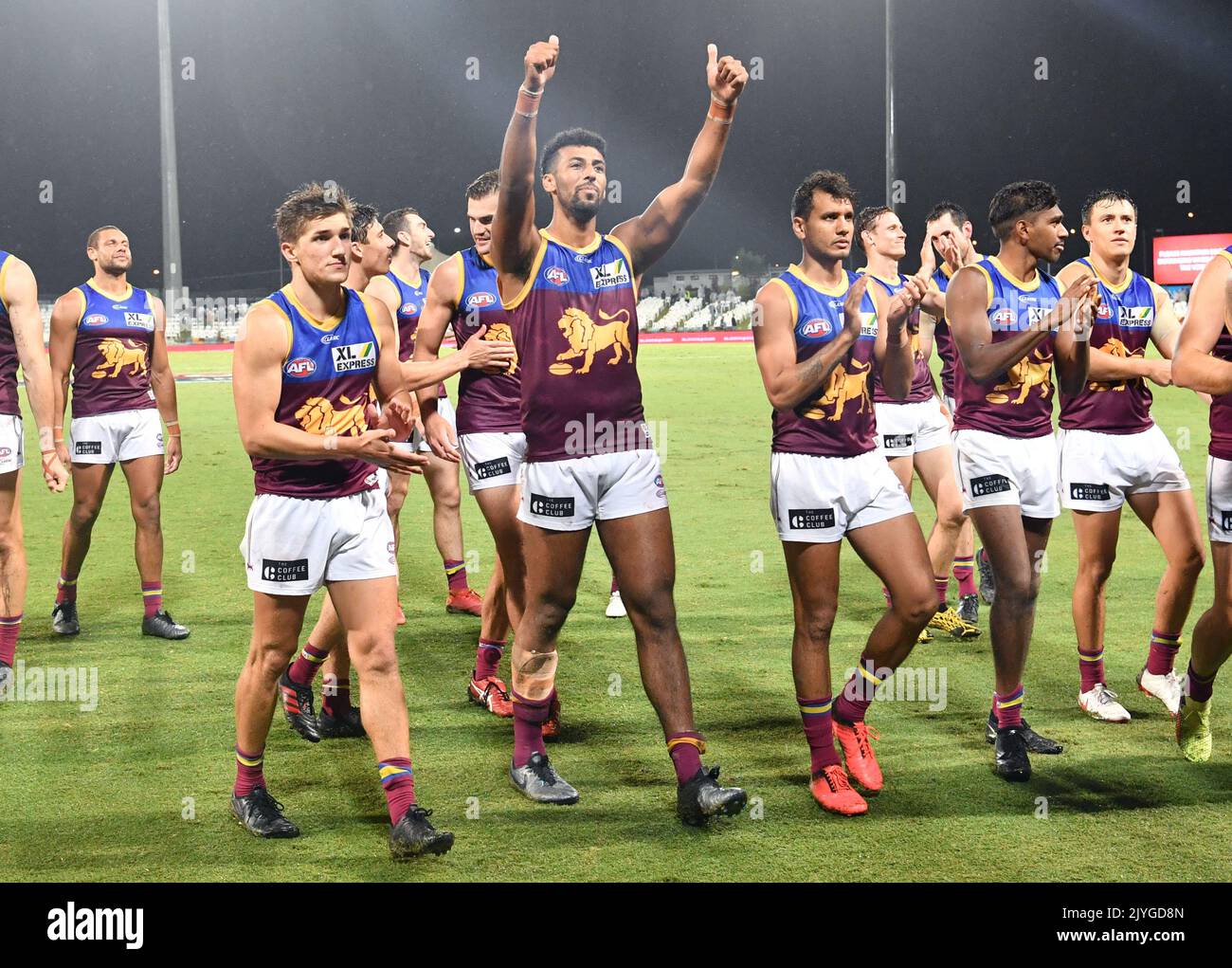 Lions players celebrate winning the Round 17 AFL match between the ...