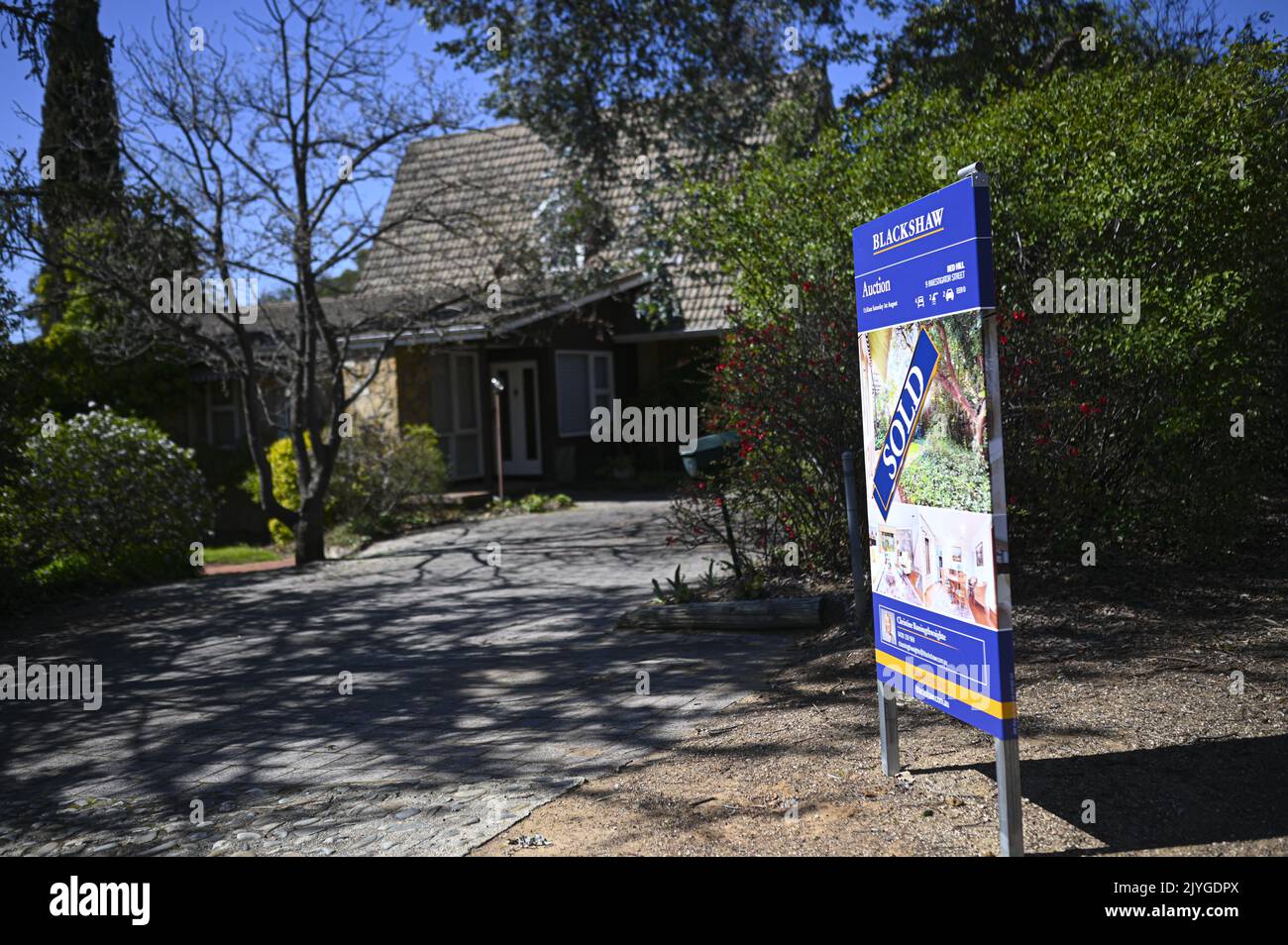 A ‘SOLD’ sticker is seen on a sale sign in front of a house in Canberra ...