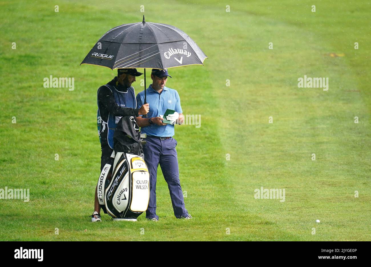 England's Oliver Wilson speaks to his caddy on the 5th fairway during ...
