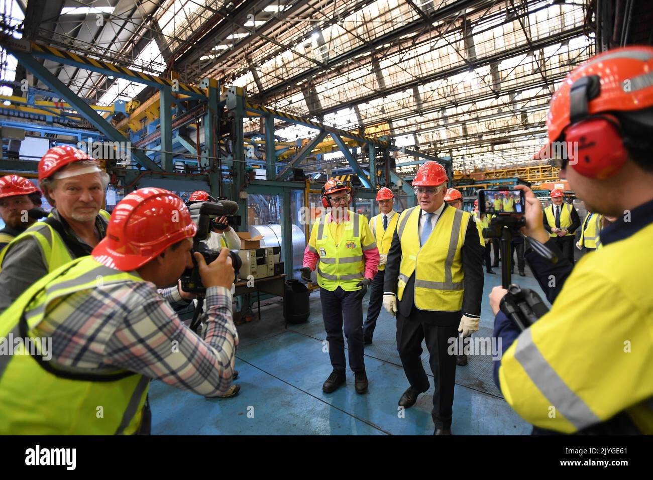 Prime Minister Scott Morrison (centre right) is given a tour by Plant ...