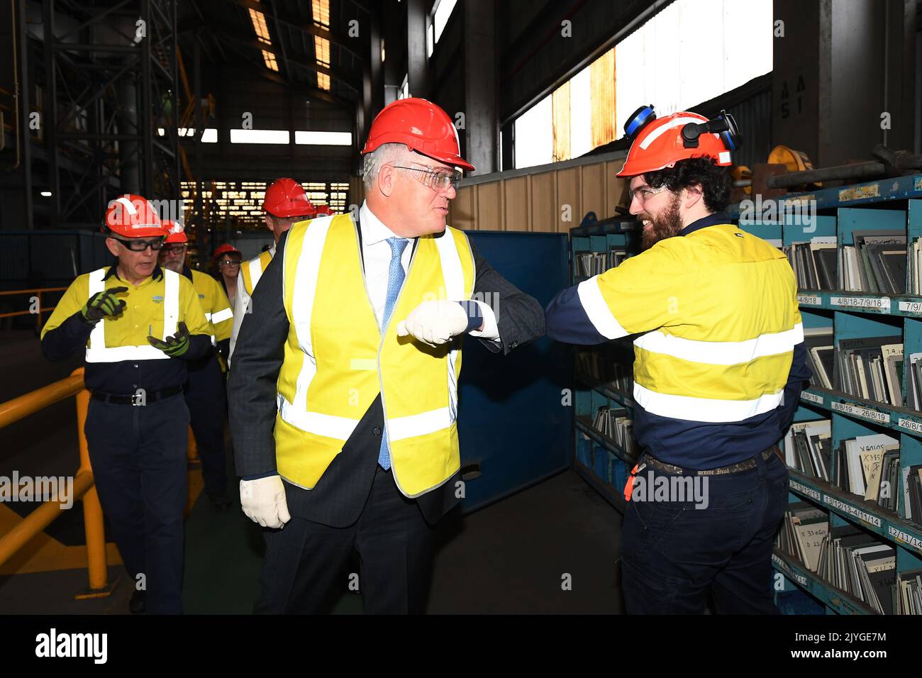 Prime Minister Scott Morrison (centre) meets steel workers during a ...