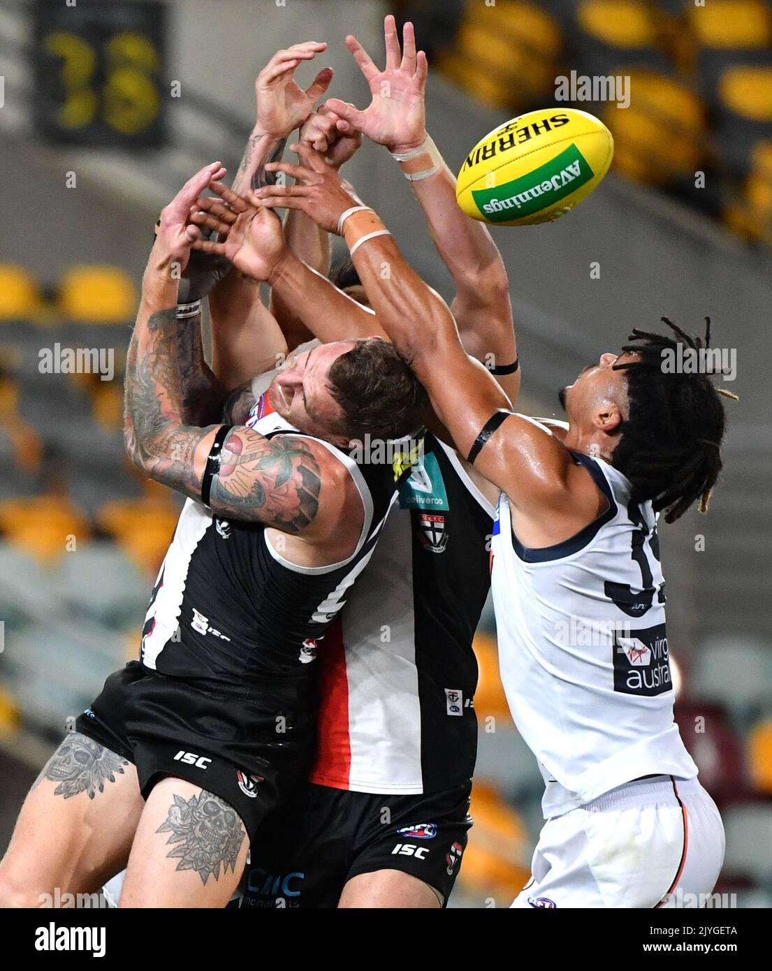 Tim Membrey (left) of the Saints contests for the ball against Connor ...