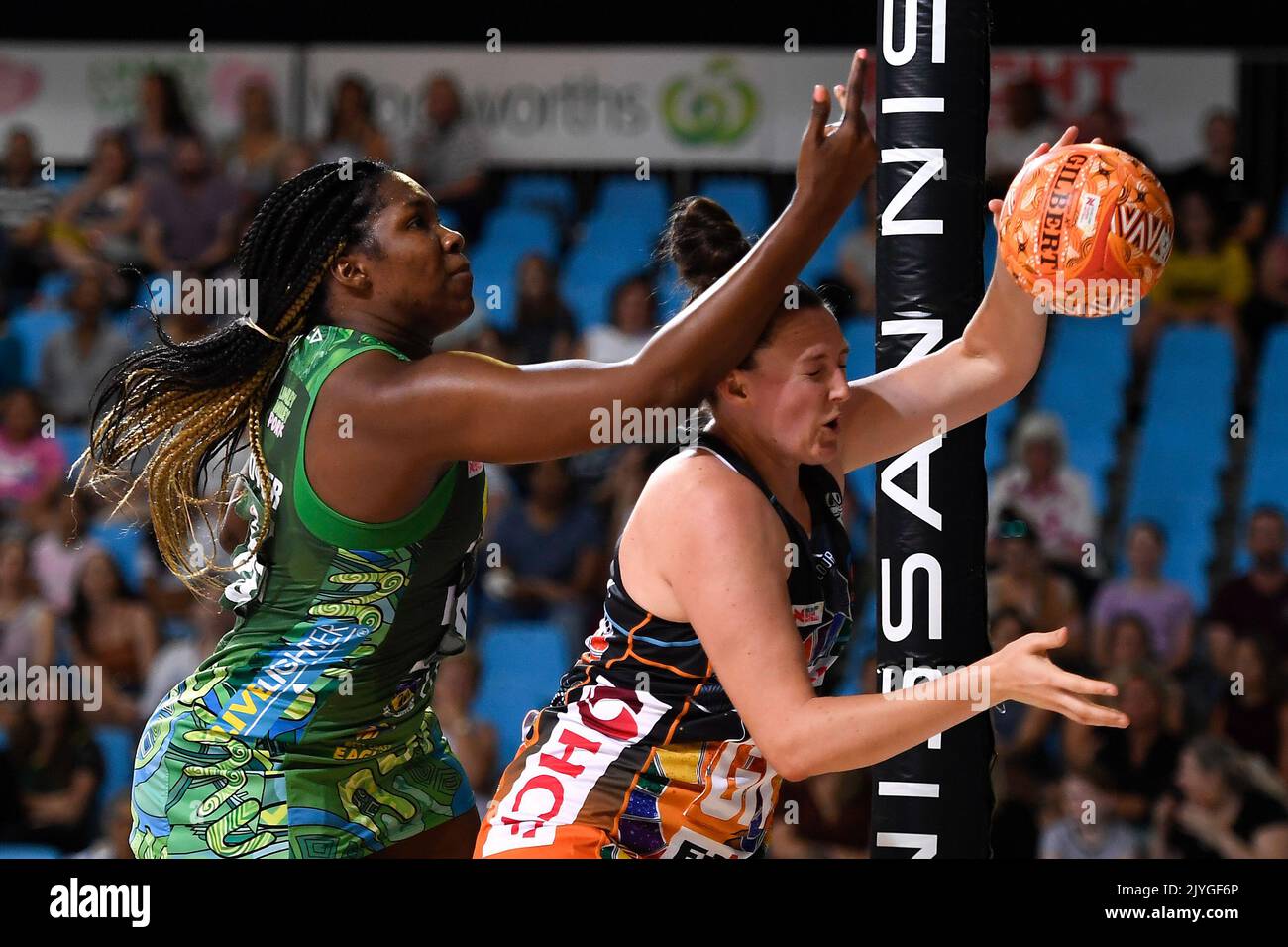 Jhaniele Fowler of the Fever and Sam Poolman of the Giants compete for ...