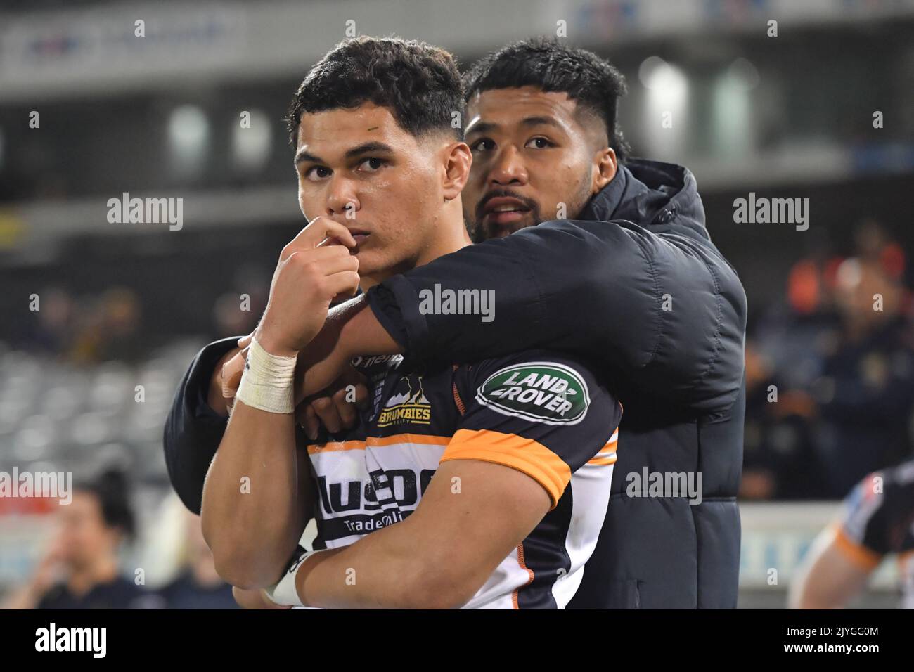 Brumbies Noah Lolesio and Folau Faingaa wait for the game to end during ...