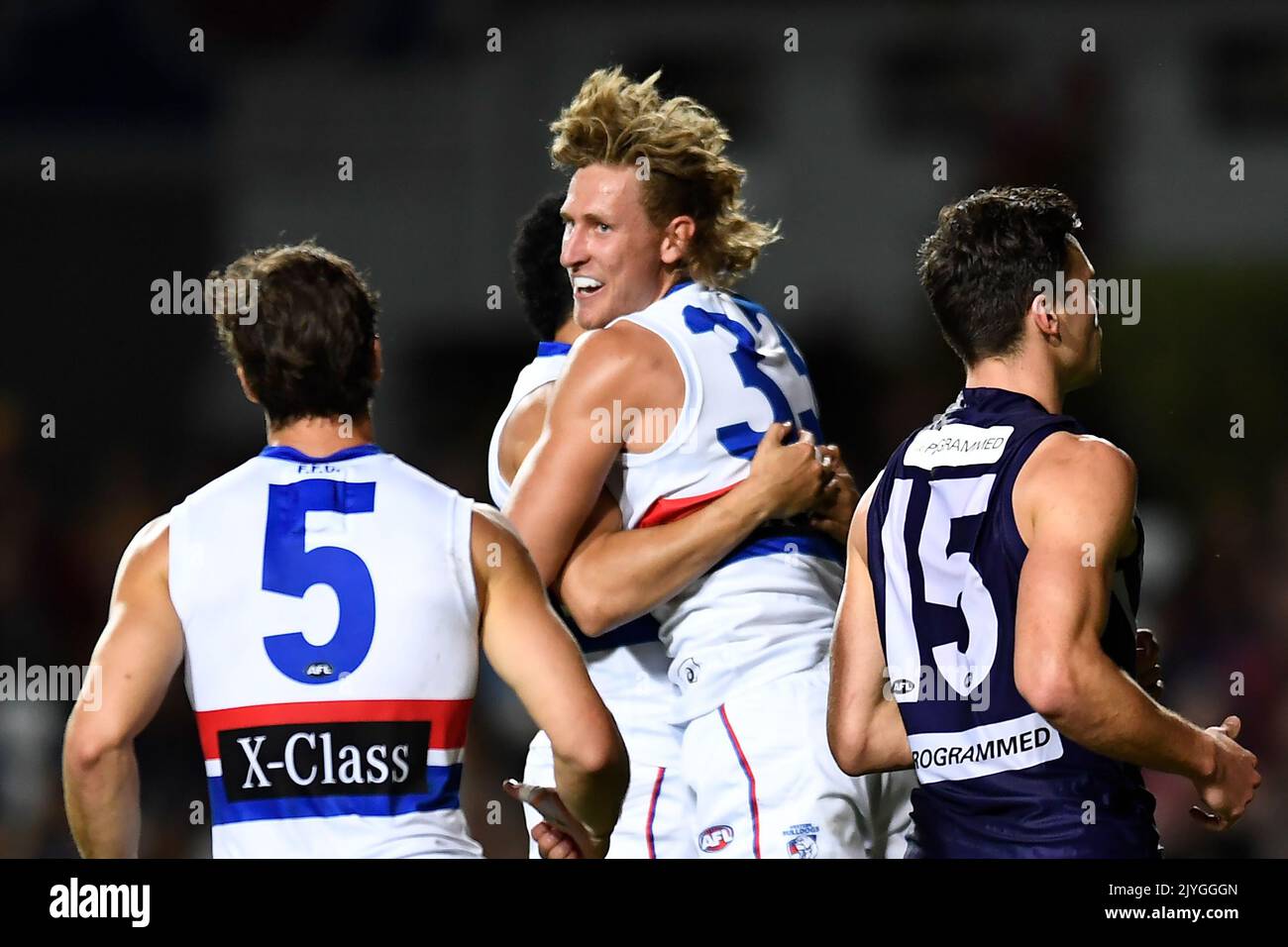 Aaron Naughton of the Bulldogs celebrates kicking a goal during the ...